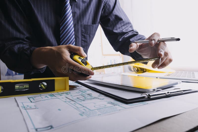 Engineer People Meeting Working and Pointing at a Drawings in Office ...