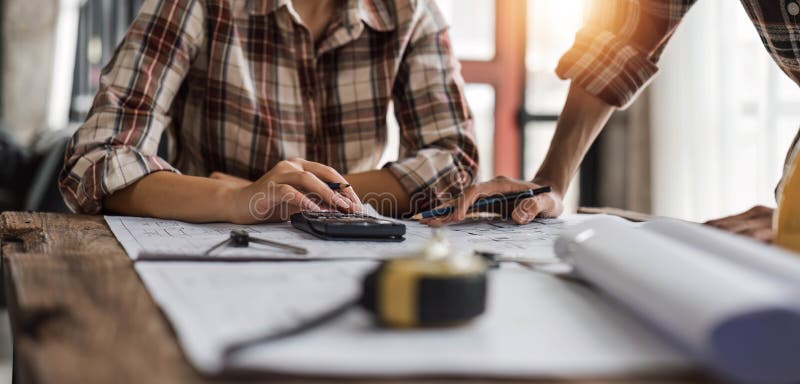 Engineer People Meeting Working and Pointing at a Drawings in Office ...