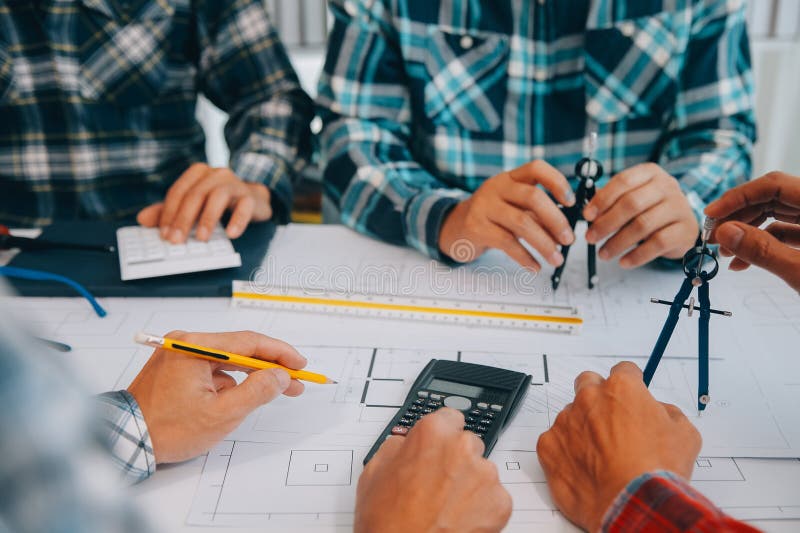 Engineer People Meeting Working and Pointing at a Drawings in Office ...