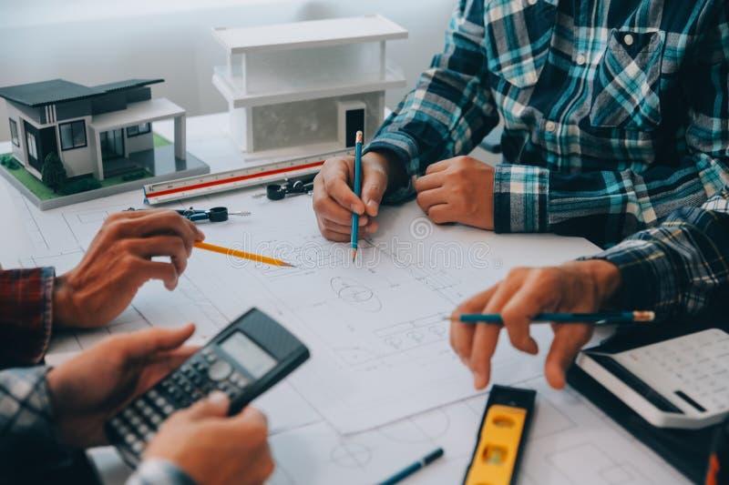 Engineer People Meeting Working and Pointing at a Drawings in Office ...
