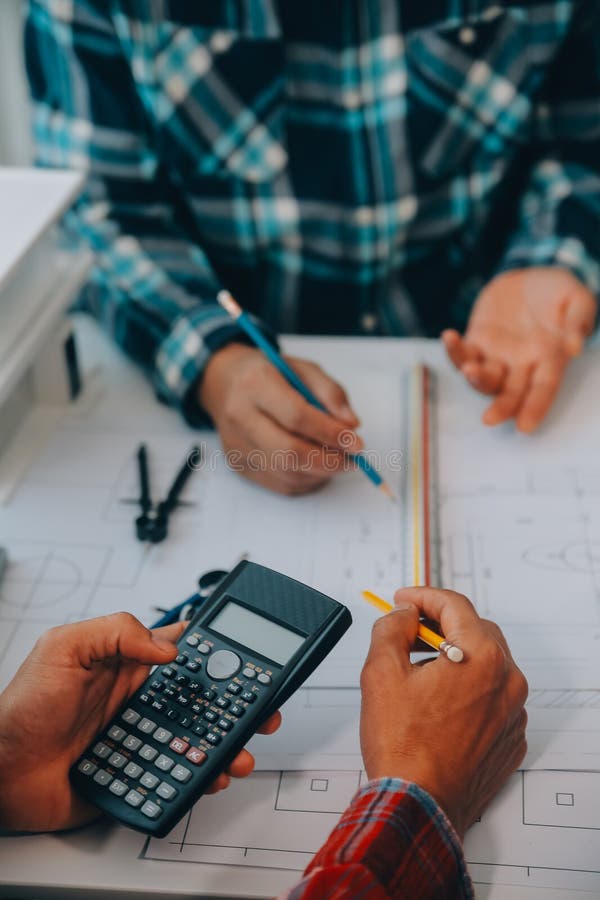 Engineer People Meeting Working and Pointing at a Drawings in Office ...