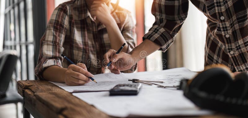 Engineer People Meeting Working and Pointing at a Drawings in Office ...