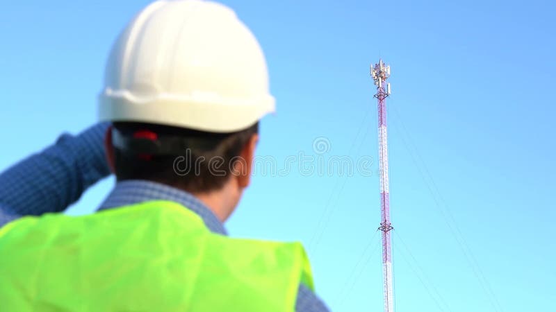 An Engineer Photographs a Telecom Tower for a Report. Stock Video ...