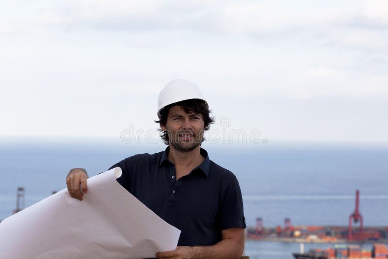 Engineer with a Plan Looking Stock Photo - Image of safety, engineer ...
