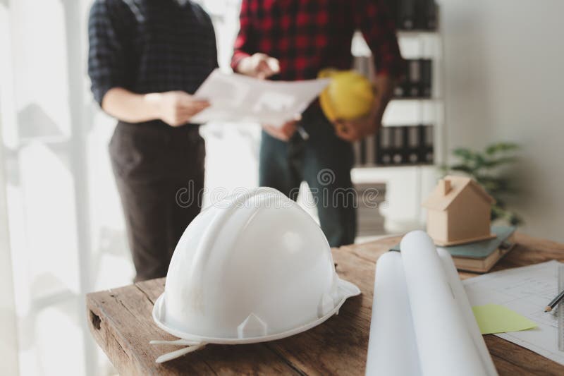 Engineer is in Planning Meeting with Architect about Building a House ...