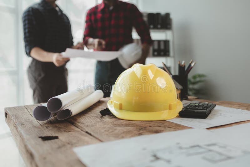 A Building and House Architect is Reviewing and Revising the House ...