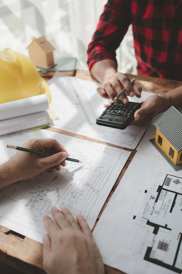 Engineer is in Planning Meeting with Architect about Building a House ...