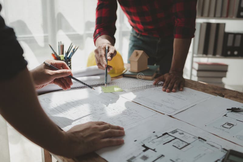 Engineer is in Planning Meeting with Architect about Building a House ...