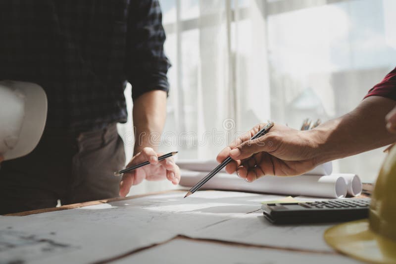 Engineer is in Planning Meeting with Architect about Building a House ...