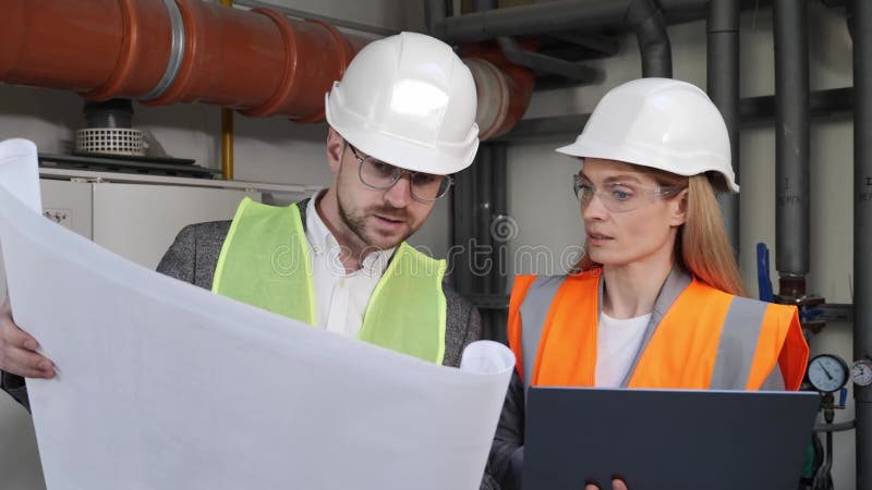 Engineer Planning Work Builders Using Blueprints and Laptop ...