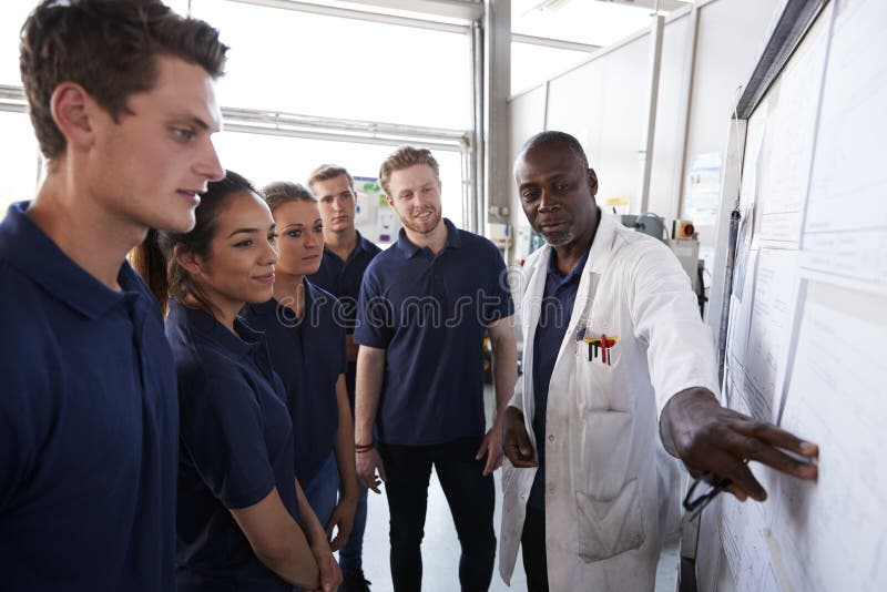 Engineer at whiteboard stock image. Image of schooled - 13267529