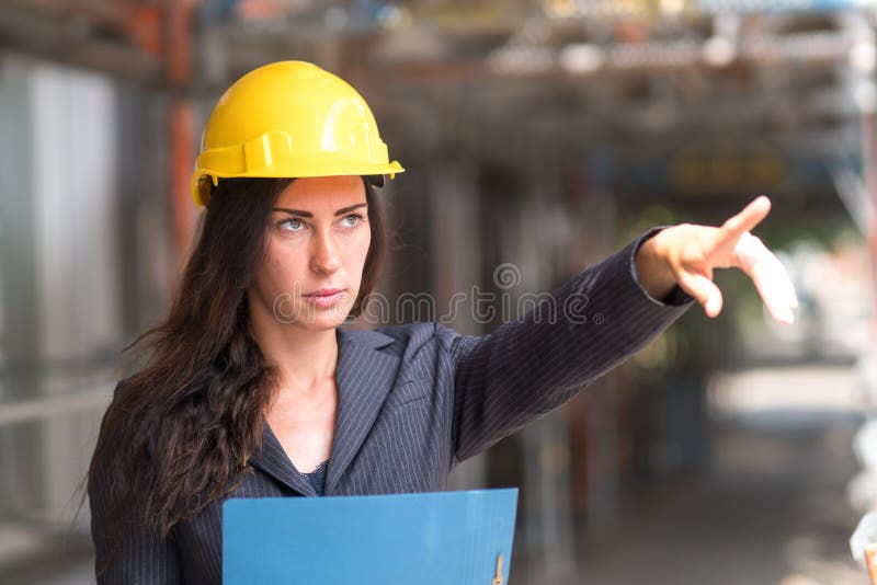 Engineer Pointing Up at Construction Site Stock Photo - Image of ...