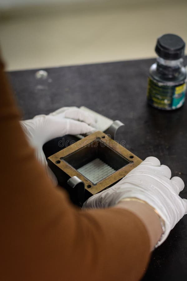 Engineer Preparing a Soil Sample in a Mold for Direct Shear Laboratory ...
