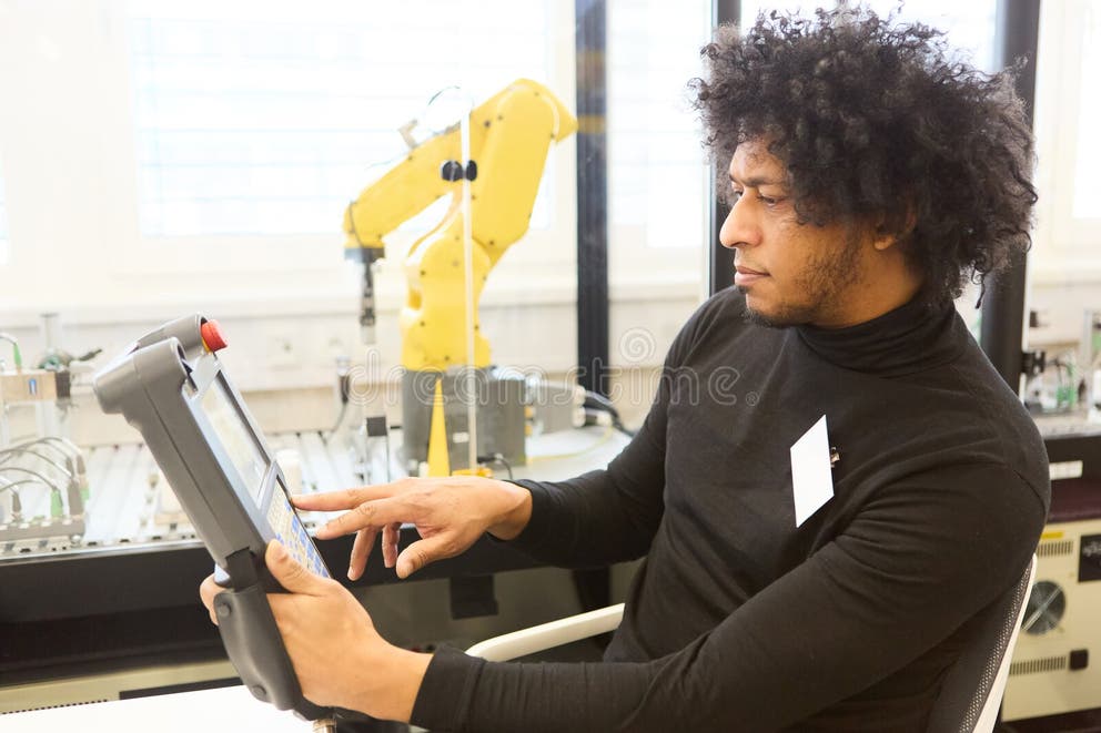 Engineer Programming Industrial Robot with Gripper Arm for Automated ...