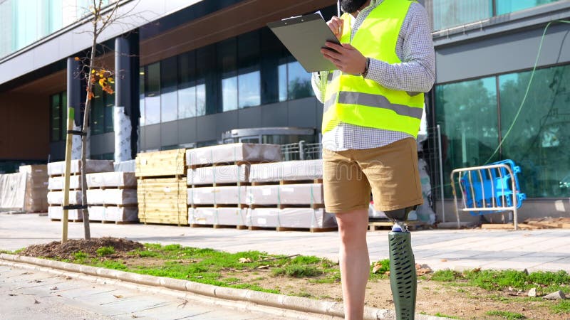 Engineer with Prosthetic Leg Working on Construction Site Stock Video ...