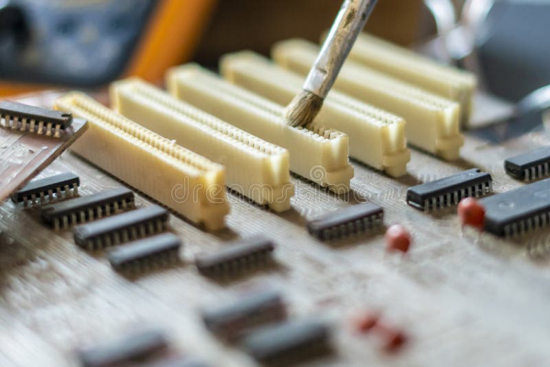 Engineer Removes Dirty Dust from the Computer Board Using a Brush F ...