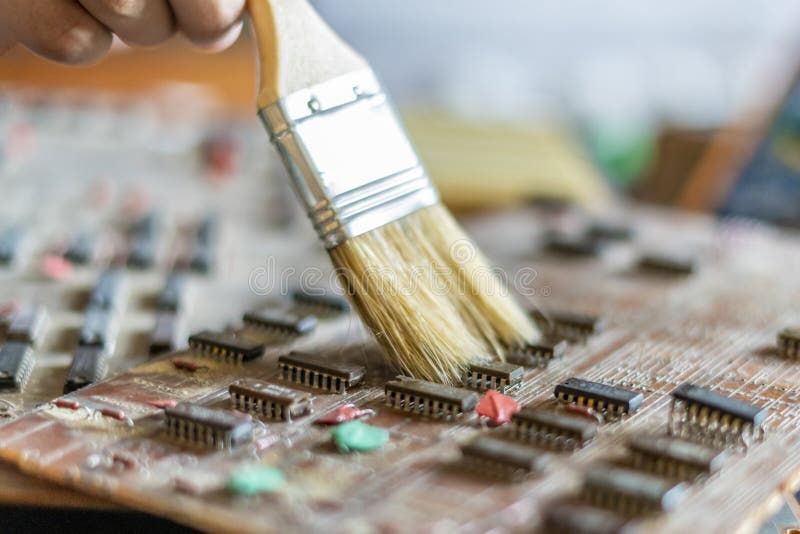 Engineer Removes Dirty Dust from the Computer Board Using a Brush F ...