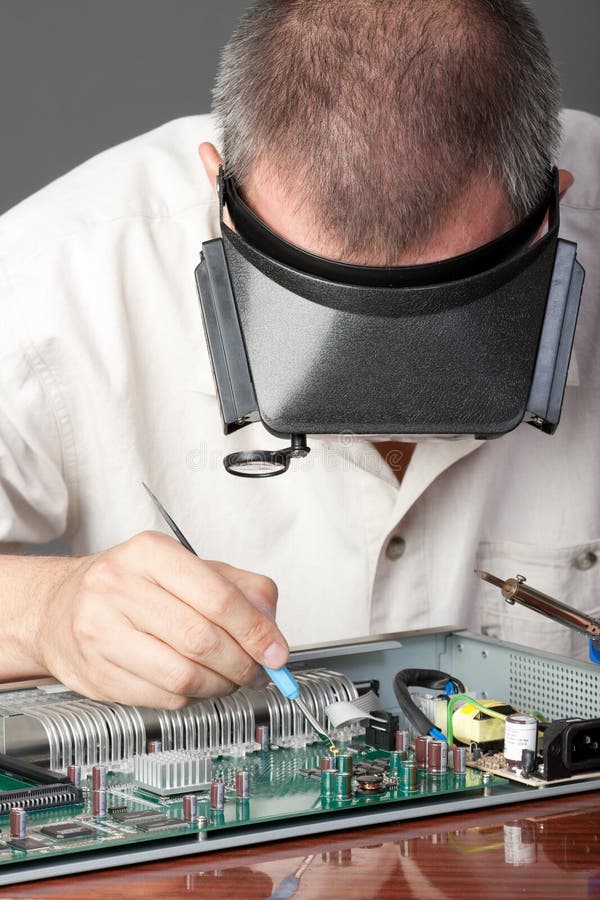 Engineer Repairing Circuit Board Stock Photo - Image of engineer, loupe ...