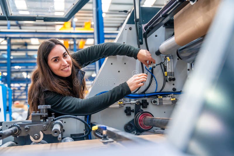 Engineer Repairing a Cnc Machine in a Modern Logistic Factory Stock ...