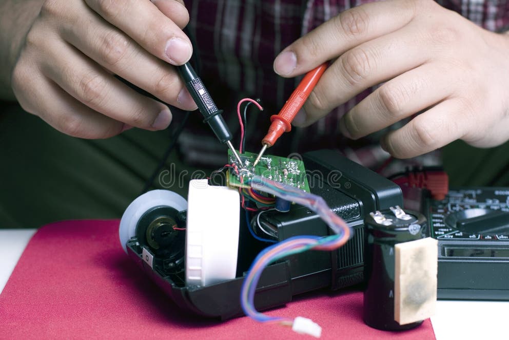 Engineer Repairing a Flash Unit Stock Photo - Image of integrated ...