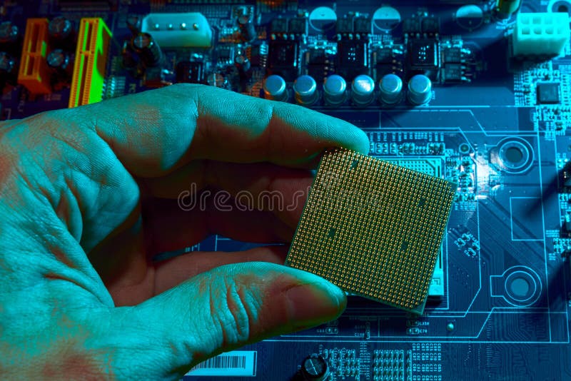 Engineer Repairman Holding Chip CPU To Insert into the Socket of ...