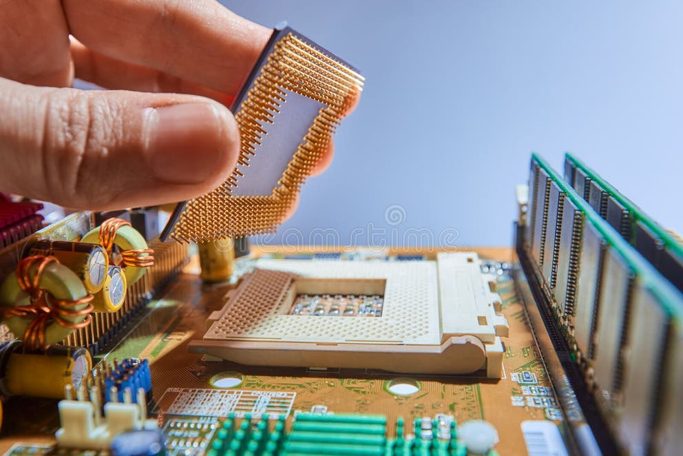 Engineer Repairman Holding Chip CPU To Insert into the Socket of ...