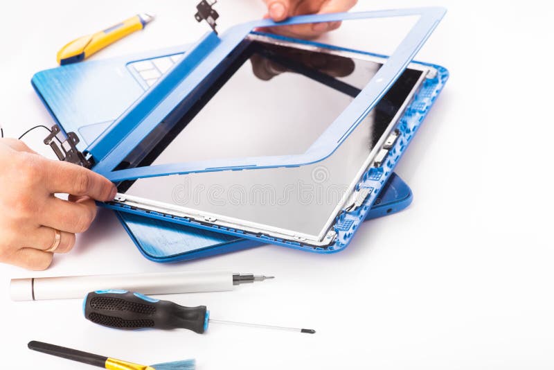 The Engineer Repairs Blue Laptop, Pc, Computer and the Screen. Laptop ...