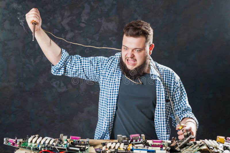 Engineer Repairs Components with Soldering Iron Stock Image - Image of ...