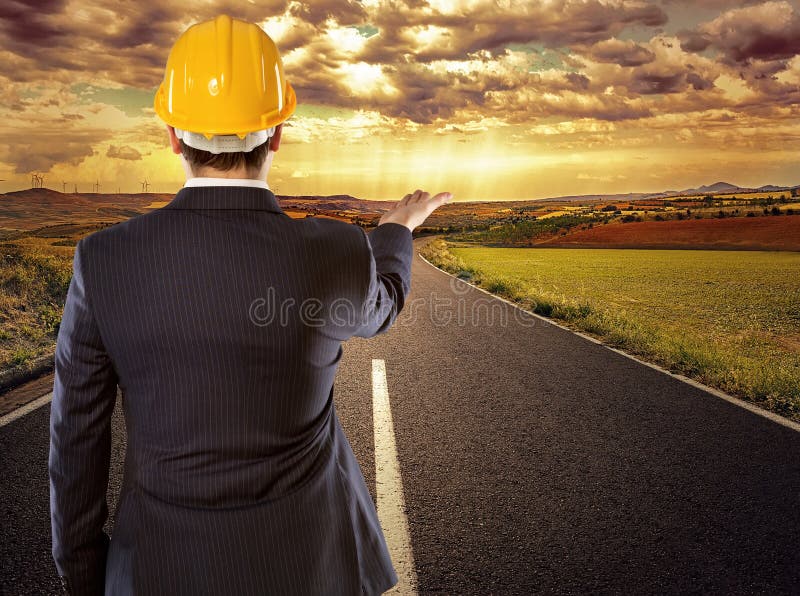 Engineer in Suit Holding Helmet with Asphalt Road Under Construction ...