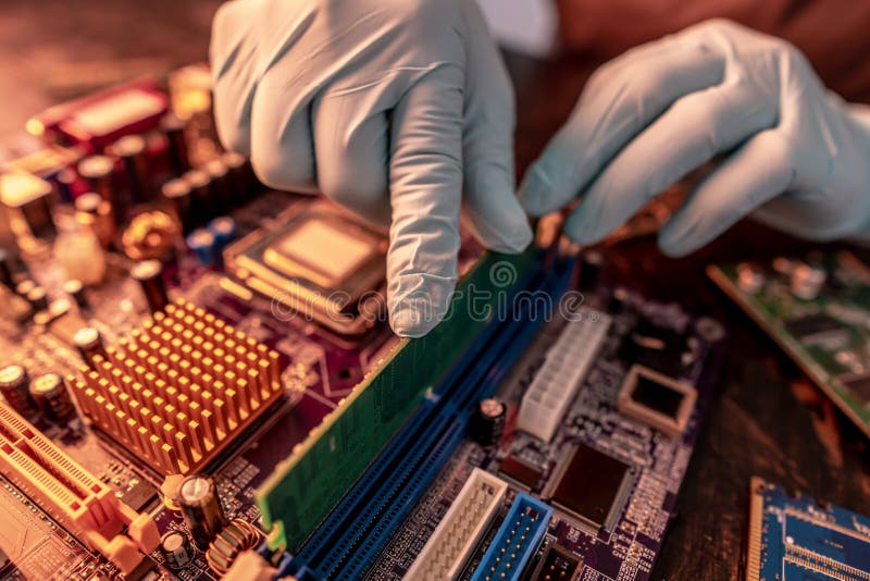 Engineer`s Gloved Hand is Holding the CPU Chip on the Background of the ...