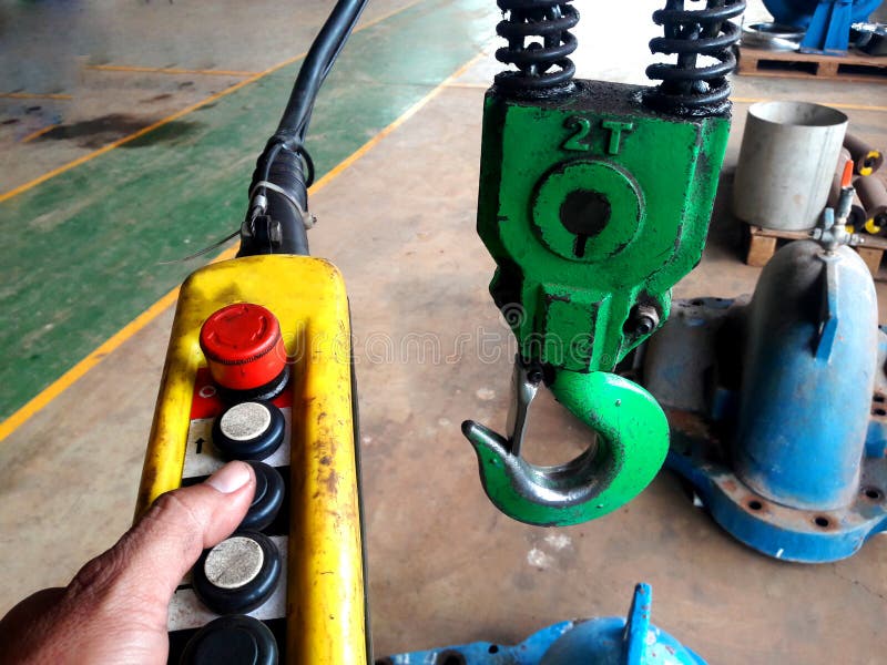 Engineer`s Hand Holding Overhead Cranes Remote in Maintenance Workshop ...