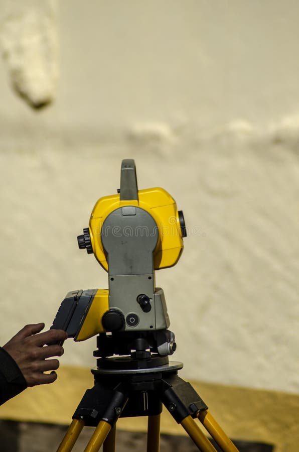 An Engineer S Hand Using a Total Station for Topographic Measurements ...