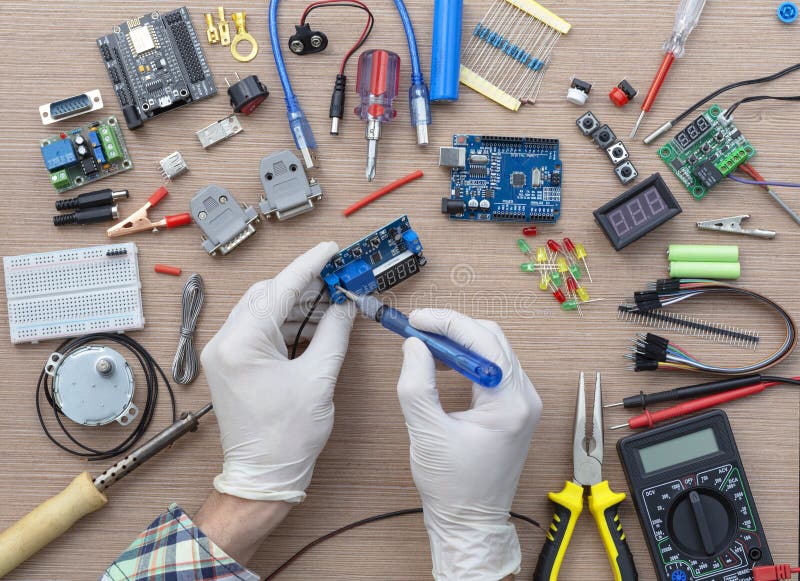 An Engineer S Hands Are Assembling A Breadboard From An Arduino Microcontroller Stock Image