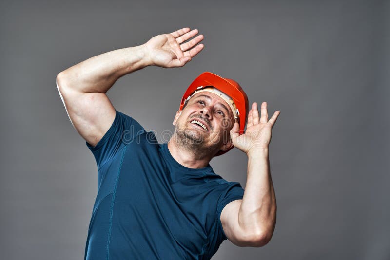 Engineer Scared of Something about To Drop from Above Stock Image ...