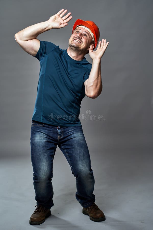 Engineer Scared of Something about To Drop from Above Stock Image ...