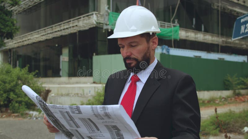An Engineer, Scientist and Developer at a Construction Site Checks on ...