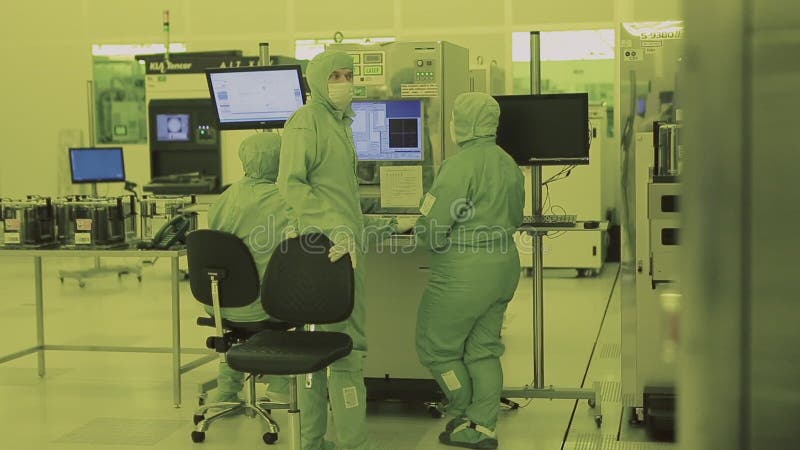 Three Workers in the Lab. Clean Area. Nanotechnology. Sterile Suit ...