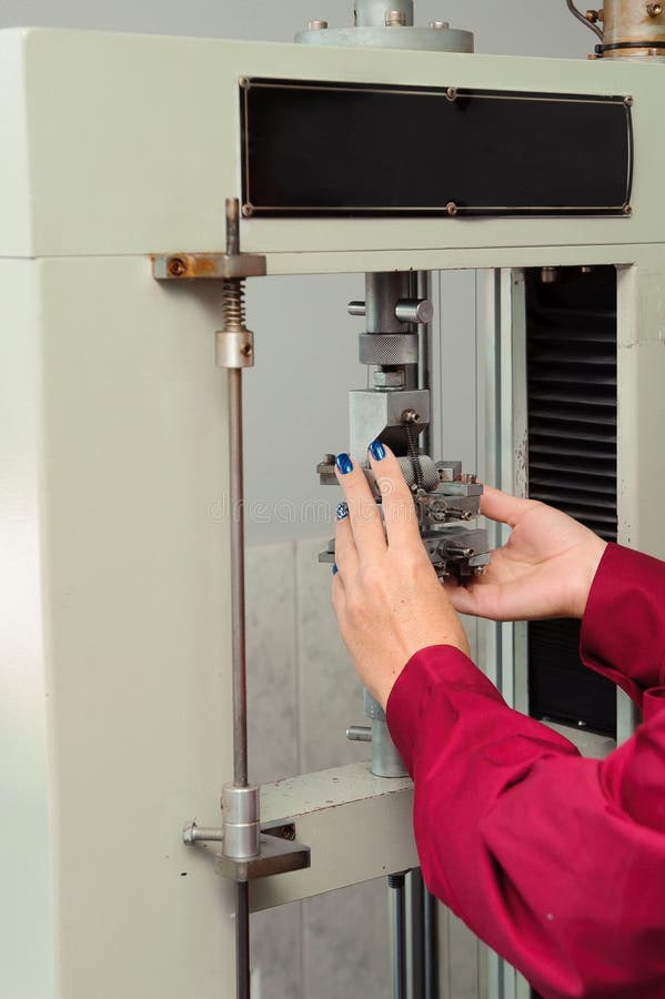 Engineer Set Up and Testing Old Machine in Factory Stock Photo - Image ...