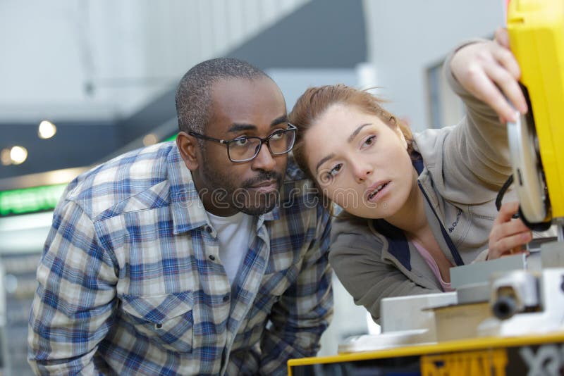 Engineer Showing Apprentice How To Use Cnc Tool Making Machine Stock ...