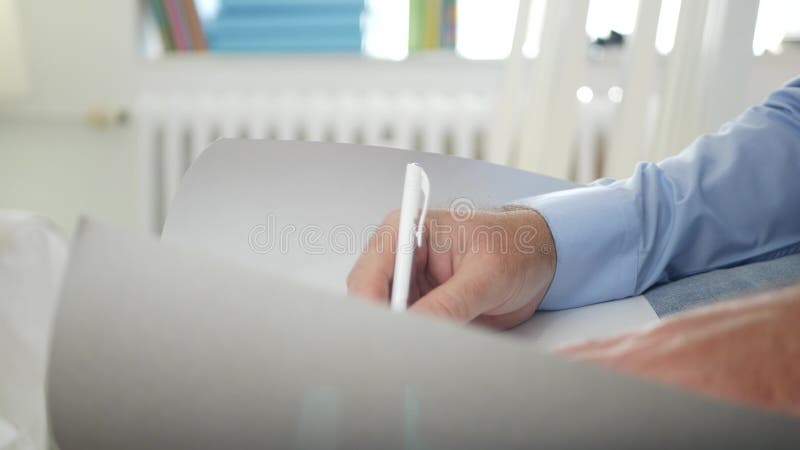 Engineer Sit on a Chair in Office Room Open a Plan and Draw Using a Pen ...