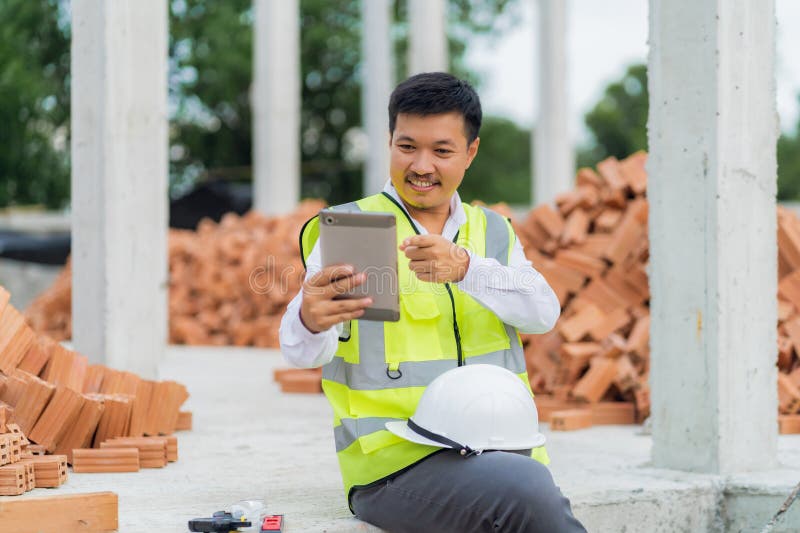 Engineer Sitting at Construction Project Holding Tablet Selfie Chatting ...