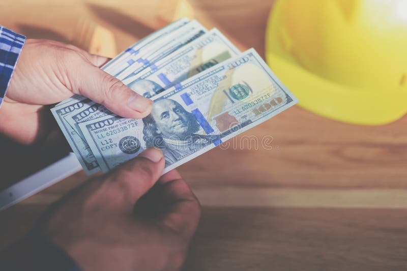 Engineer Sitting and Counting Dollar Bills. Stock Image - Image of ...