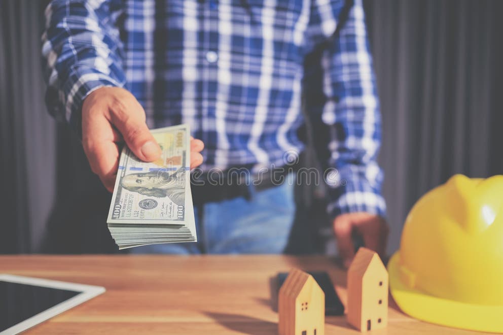 Engineer Sitting and Counting Dollar Bills. Stock Image - Image of ...