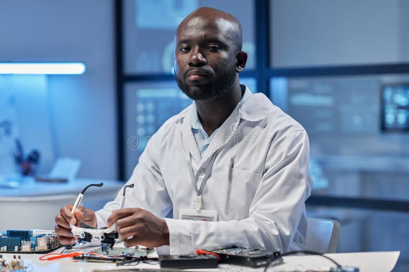 Engineer Sitting at His Workplace in the Lab Stock Photo - Image of ...