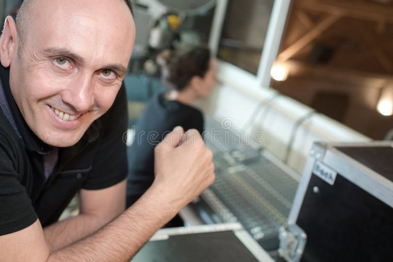 Engineer Sitting at Mixing Desk in Recording Studio Stock Photo - Image ...