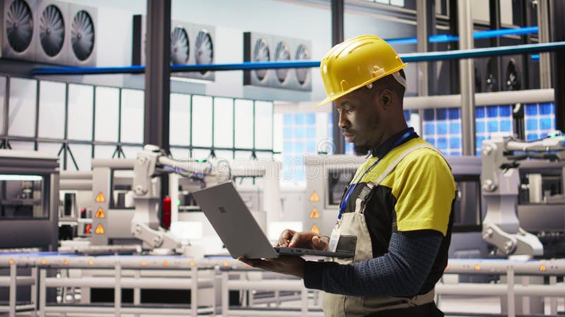 Engineer in Smart Factory Does Maintenance Using Laptop Software ...