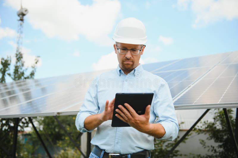 Engineer at Solar Power Station with Solar Panel. Practical Lessons on ...