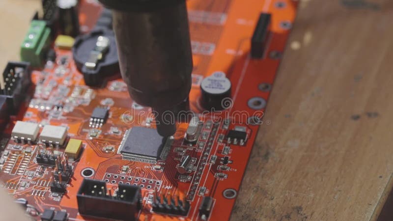 Engineer Solder Chip To Microchip. Close-up of Soldering Microcircuit ...