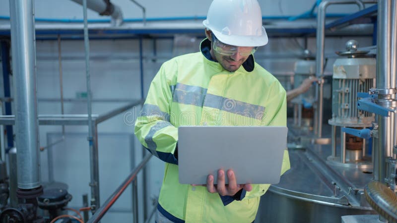 Engineer Specialist Checking and Controlling Machine in Industrial ...