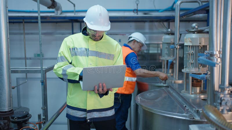 Engineer Specialist Checking and Controlling Machine in Industrial ...